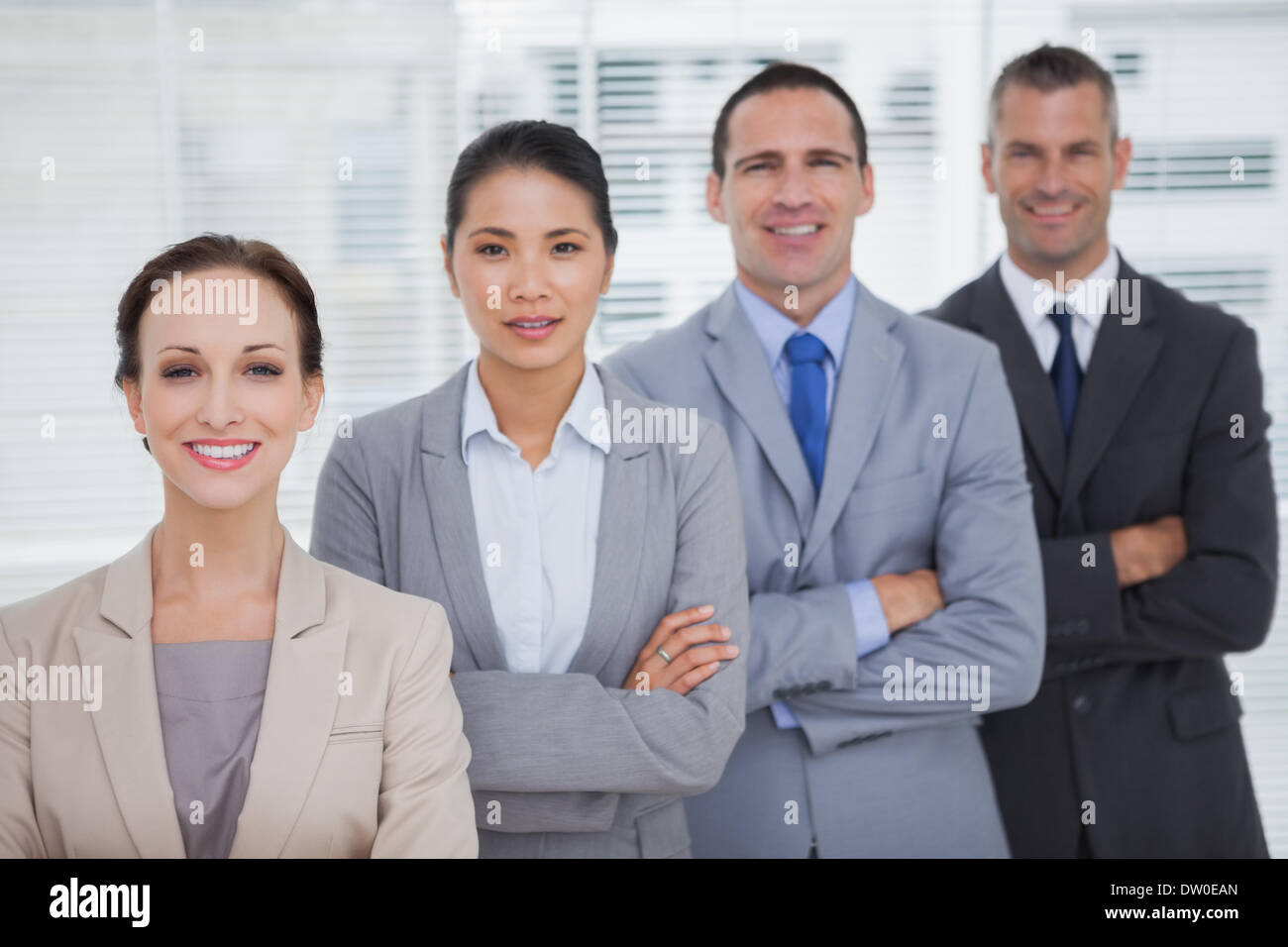 Professional business team crossing arms hi-res stock photography and ...