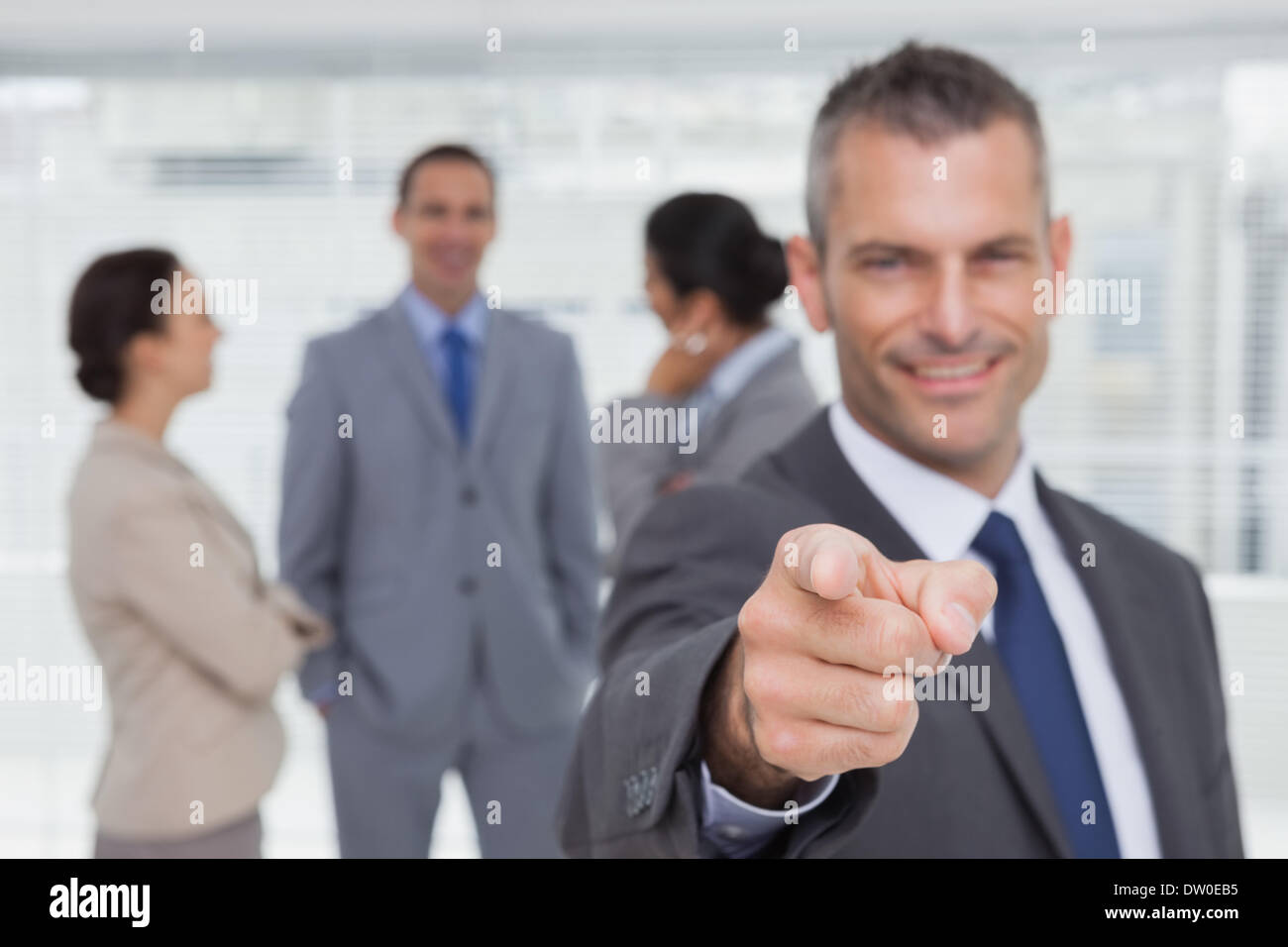 Portrait happy businessman talking pointing hi-res stock photography ...