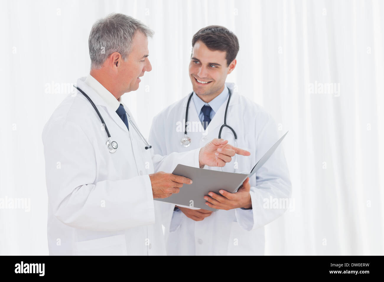Handsome smiling doctors standing hi-res stock photography and images ...