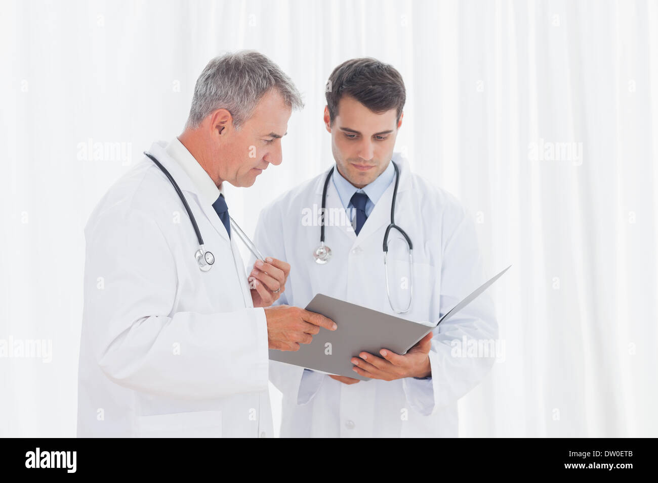 Doctors analyzing results together Stock Photo - Alamy