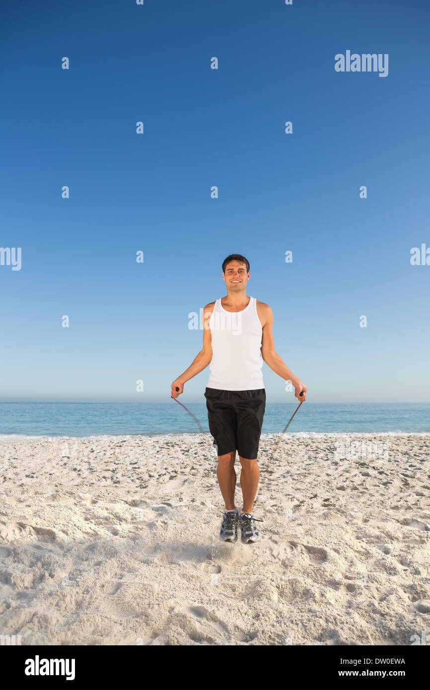Sporty man jumping rope Stock Photo - Alamy