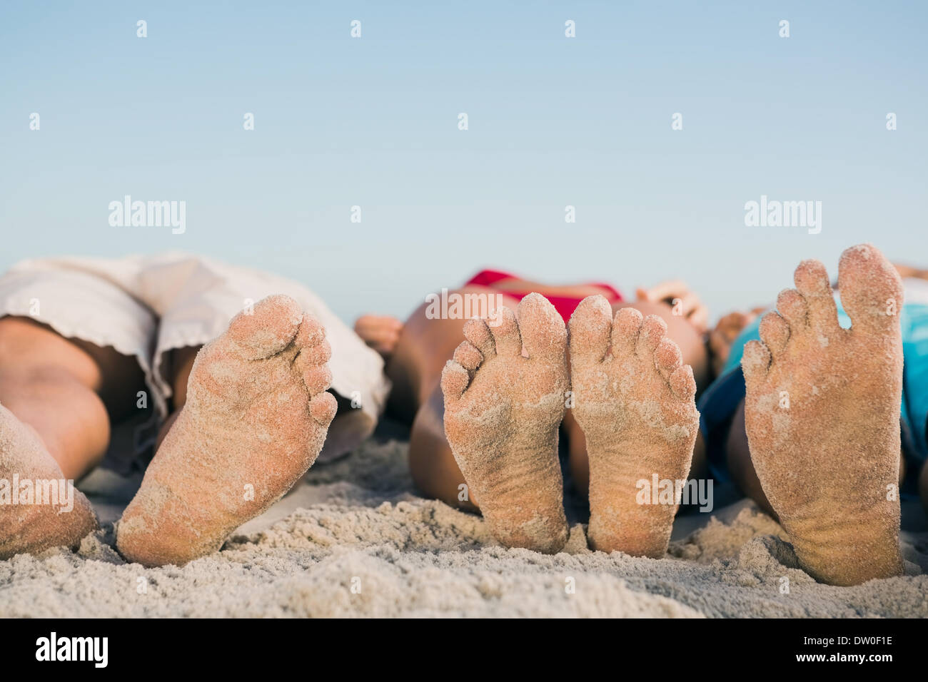 Picture of friends feet lying together Stock Photo - Alamy
