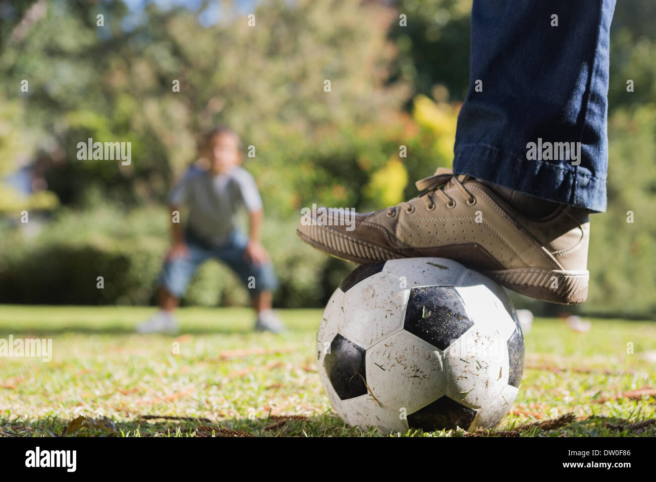 Father and son playing football Stock Photo - Alamy