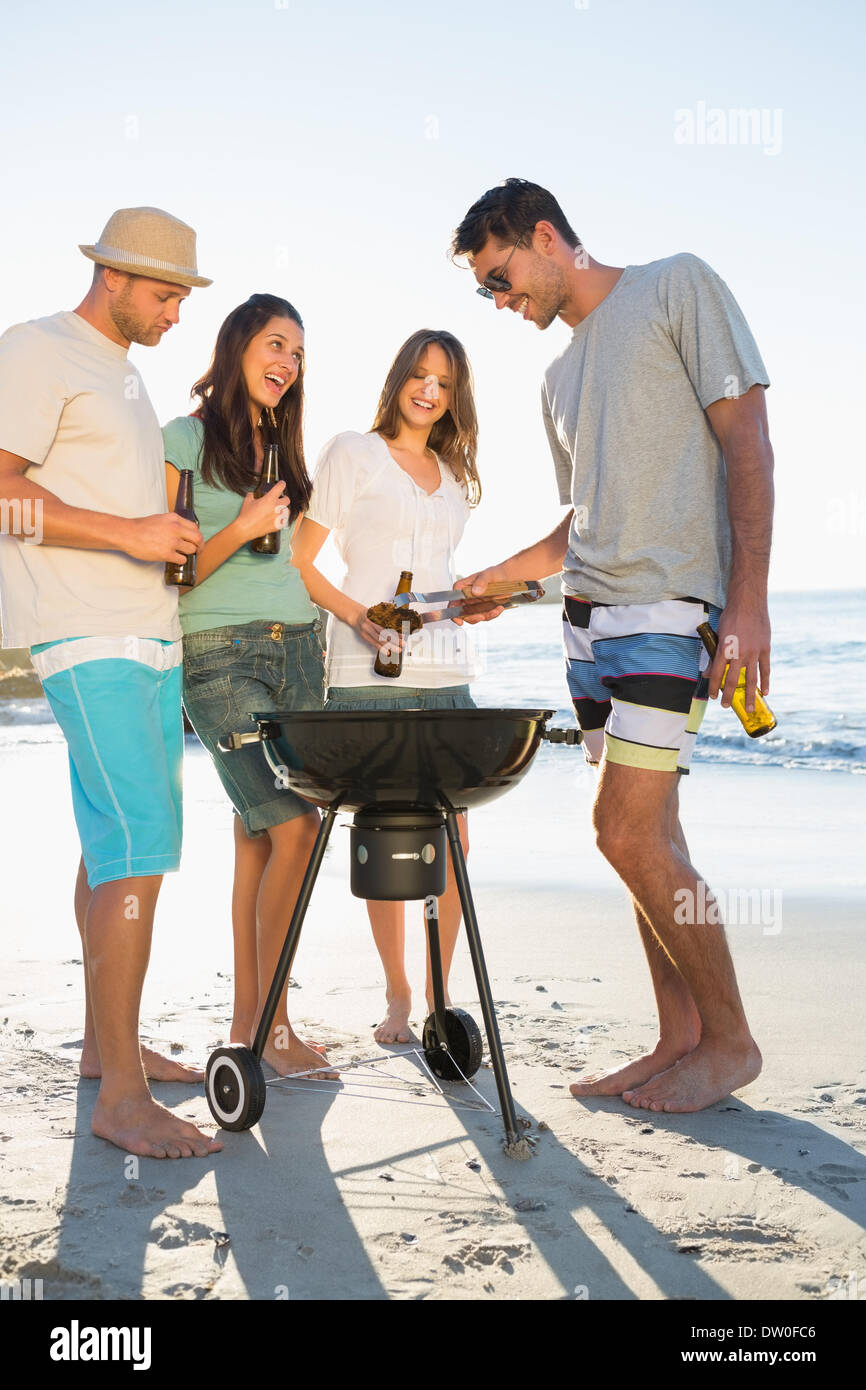 Young friends having barbecue hi-res stock photography and images - Alamy