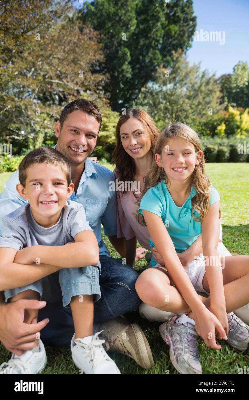 Cheerful boy hugging parents hi-res stock photography and images - Alamy
