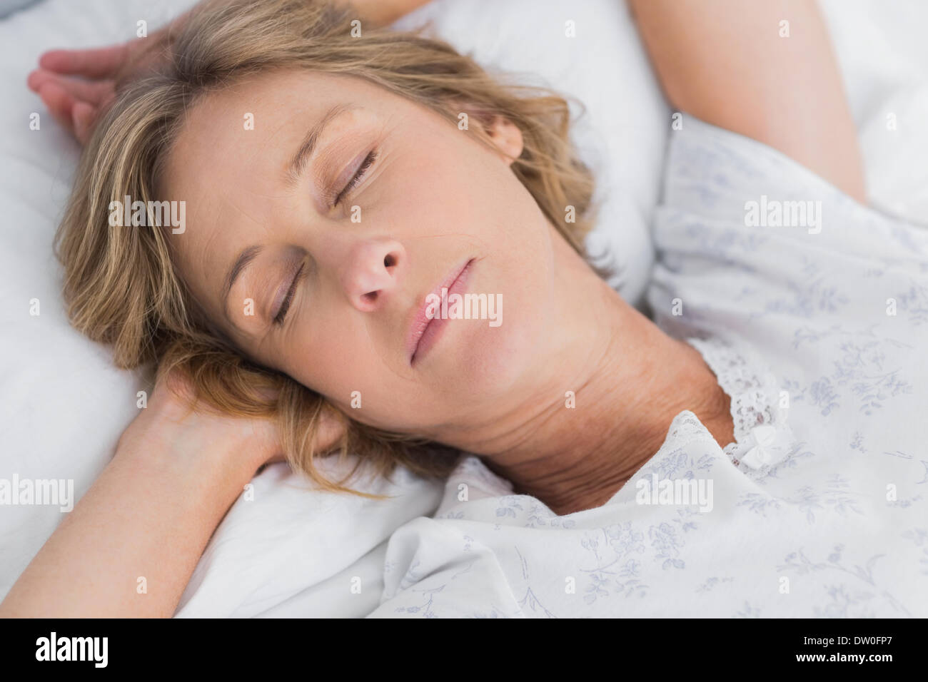 Woman sleeping peacefully in bed hi-res stock photography and images ...
