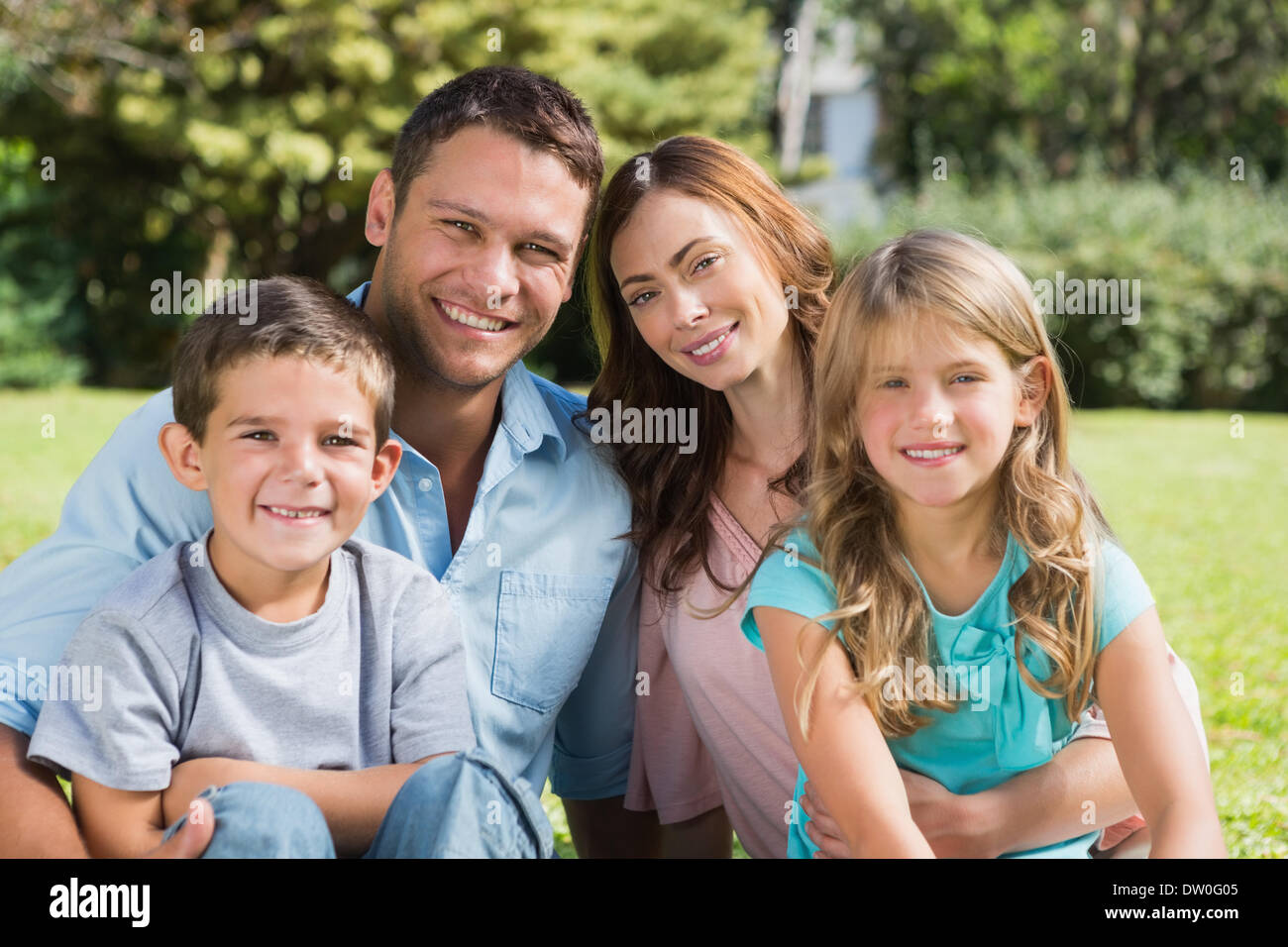 Family enjoying the sun Stock Photo - Alamy