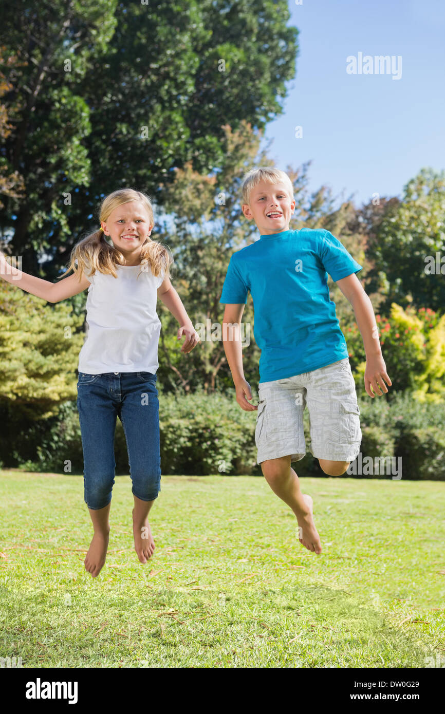 Family jumping together park hi-res stock photography and images - Alamy