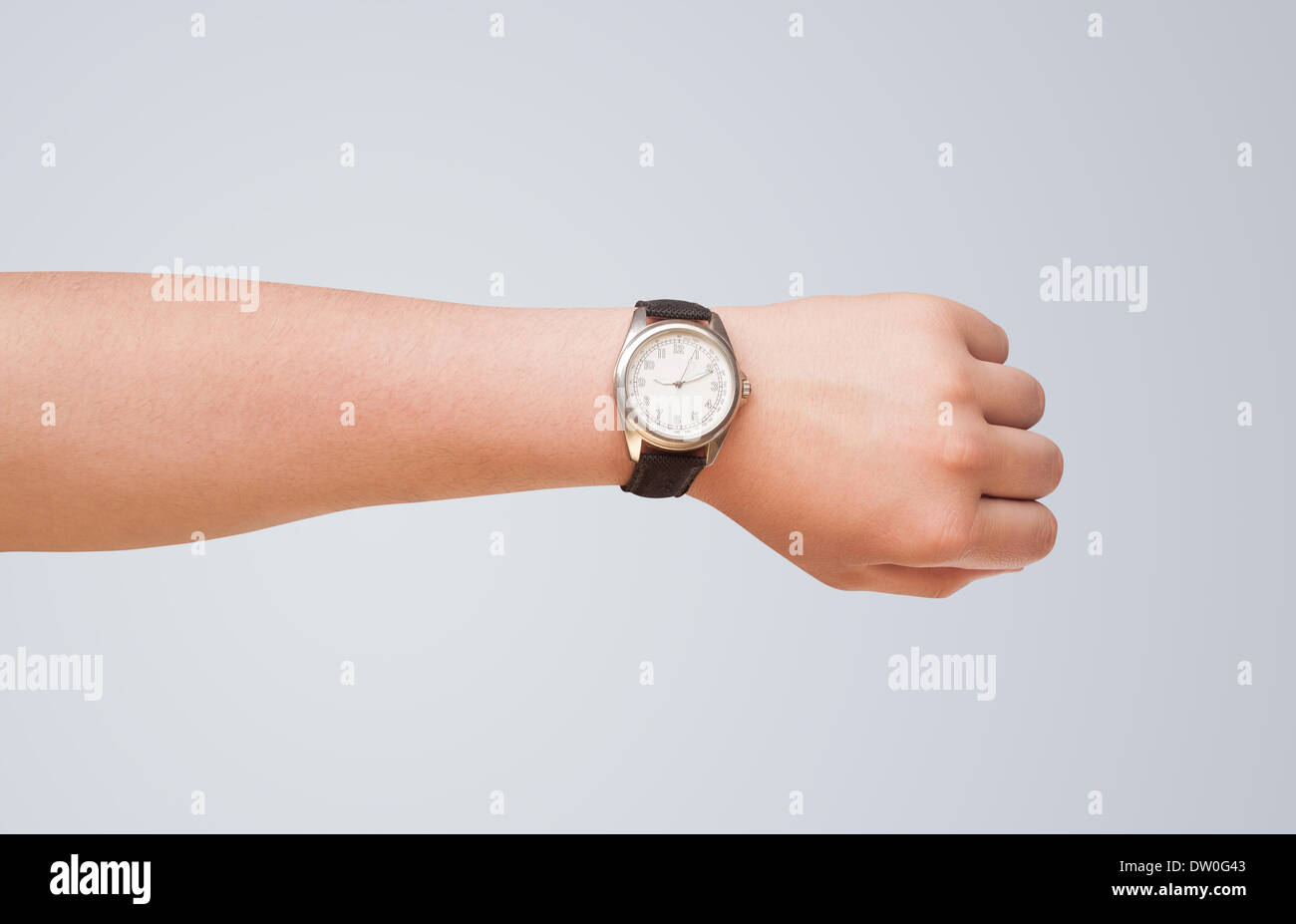 Hand with watch showing precise time Stock Photo - Alamy