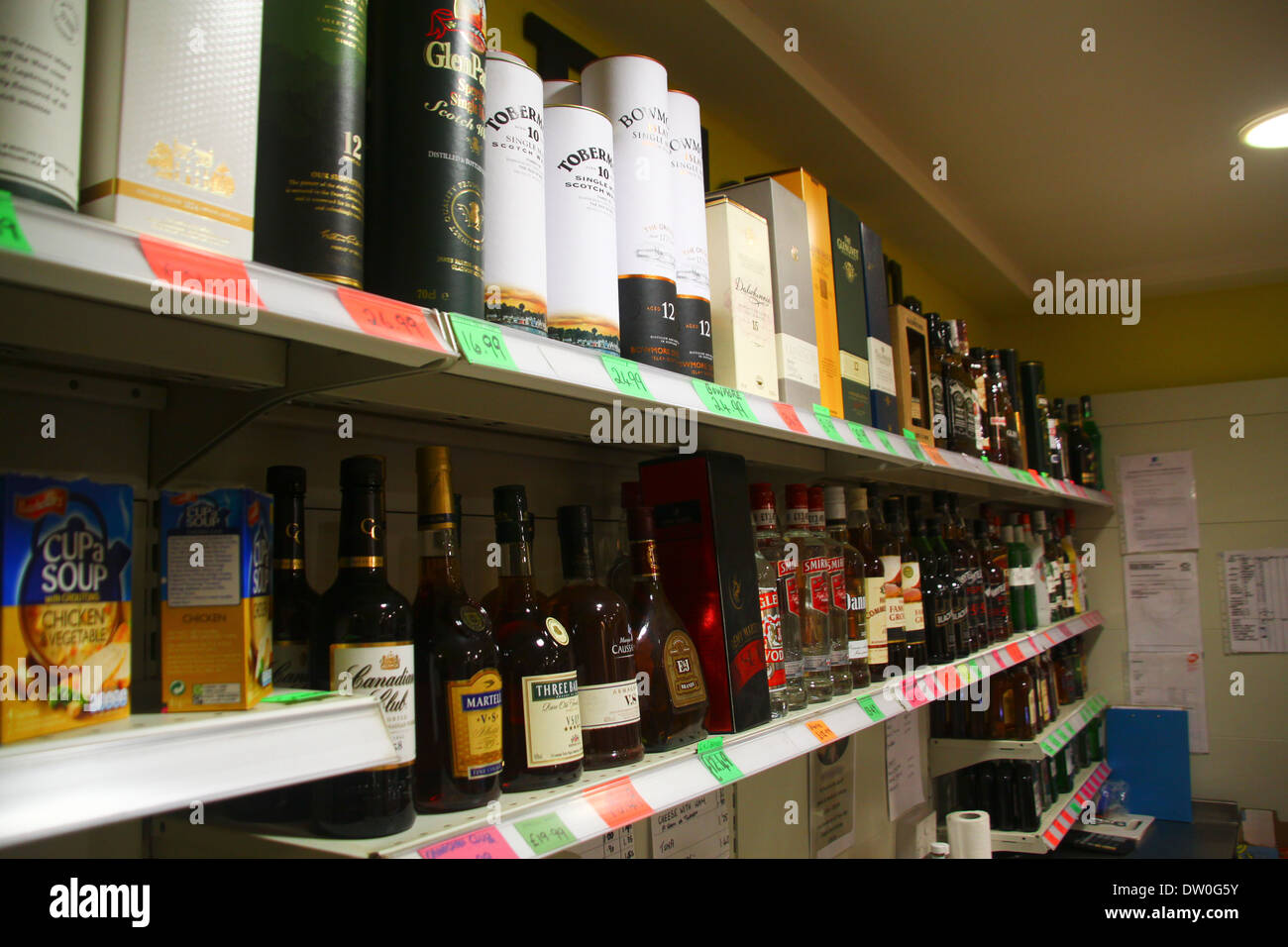 Alcohol on sale on shop shelf Stock Photo - Alamy