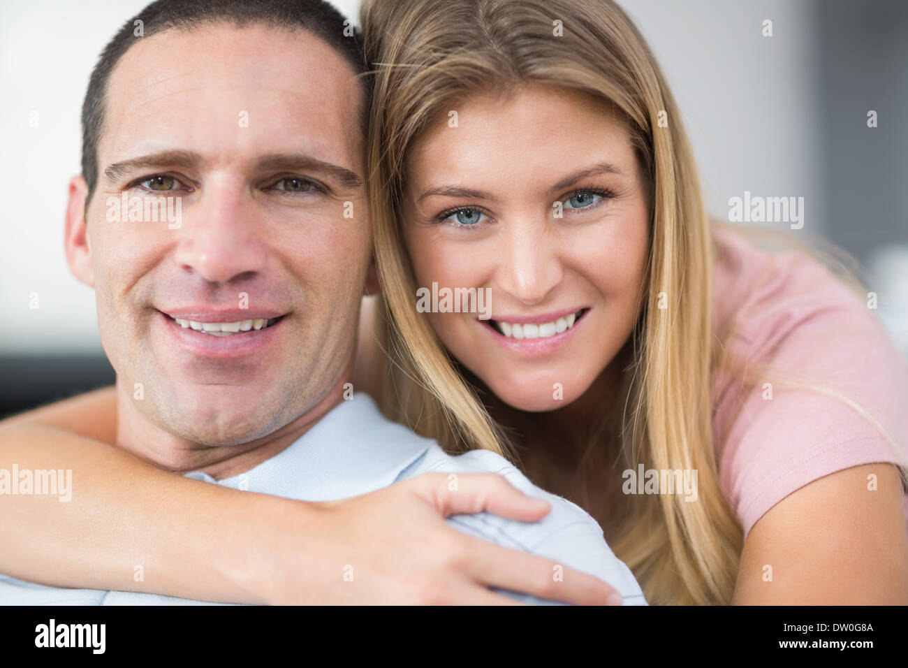 Woman hugging her partner from behind Stock Photo - Alamy