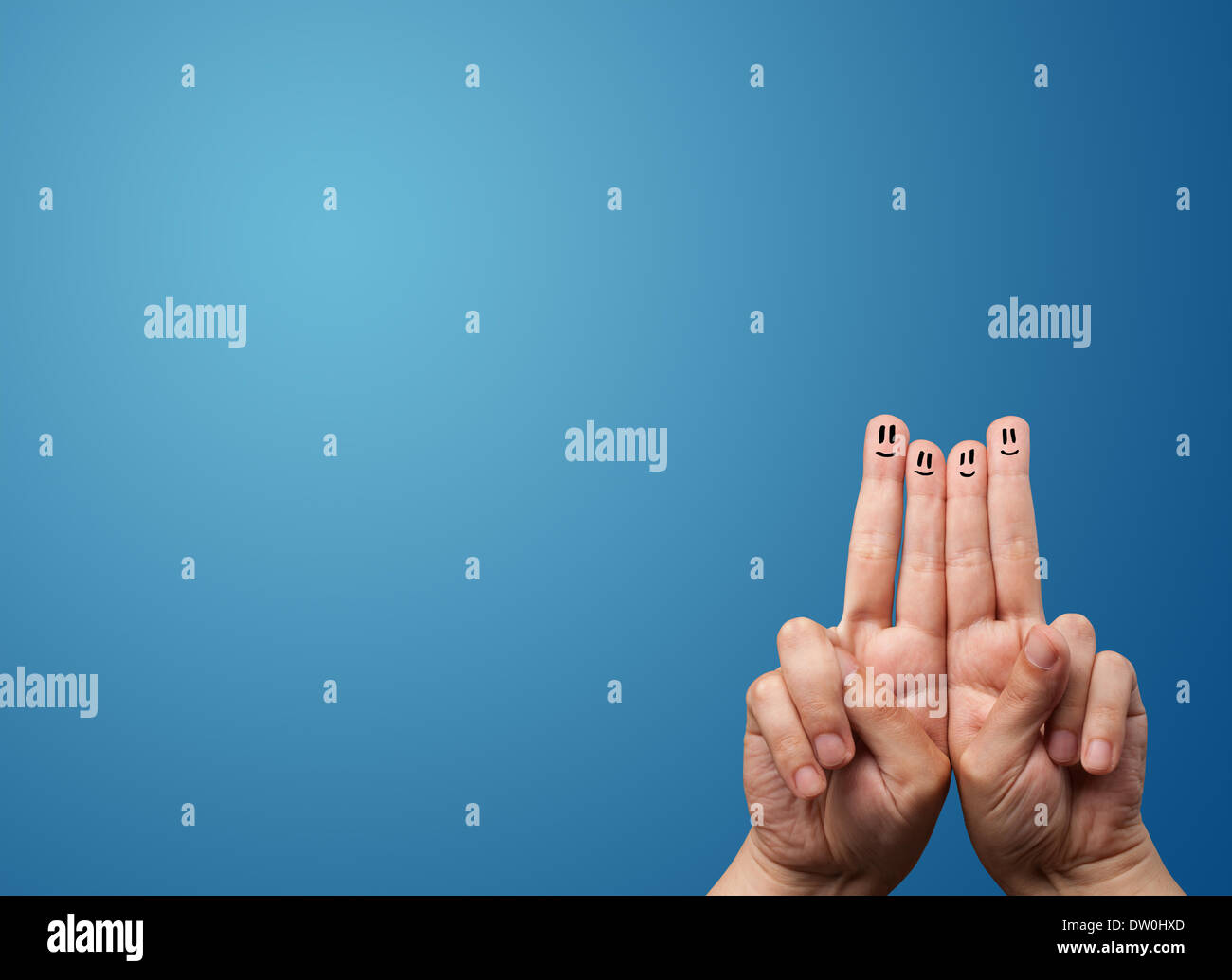Happy smiley face fingers looking at empty blue background copy space ...