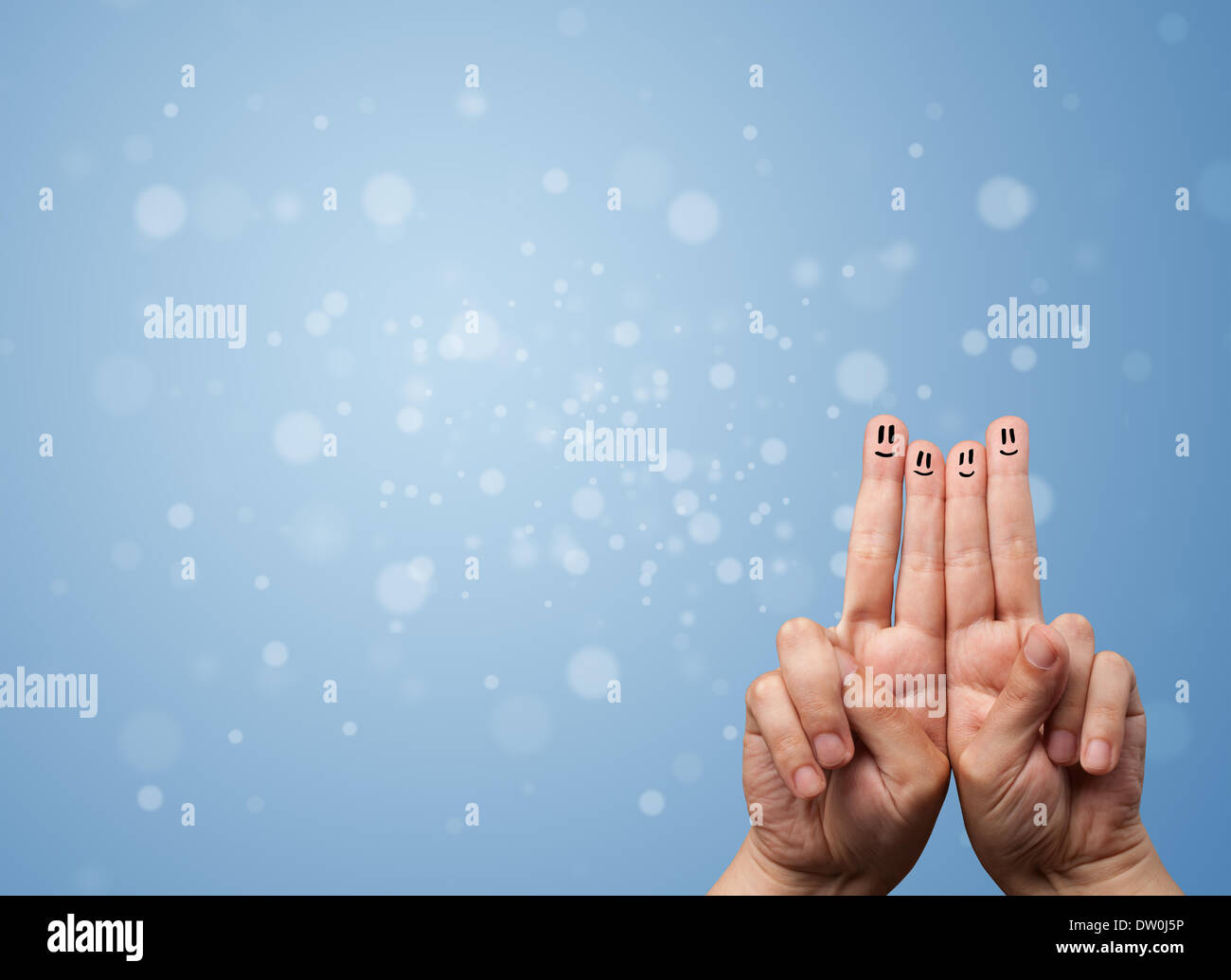 Happy finger smileys with empty blue bokeh background Stock Photo - Alamy