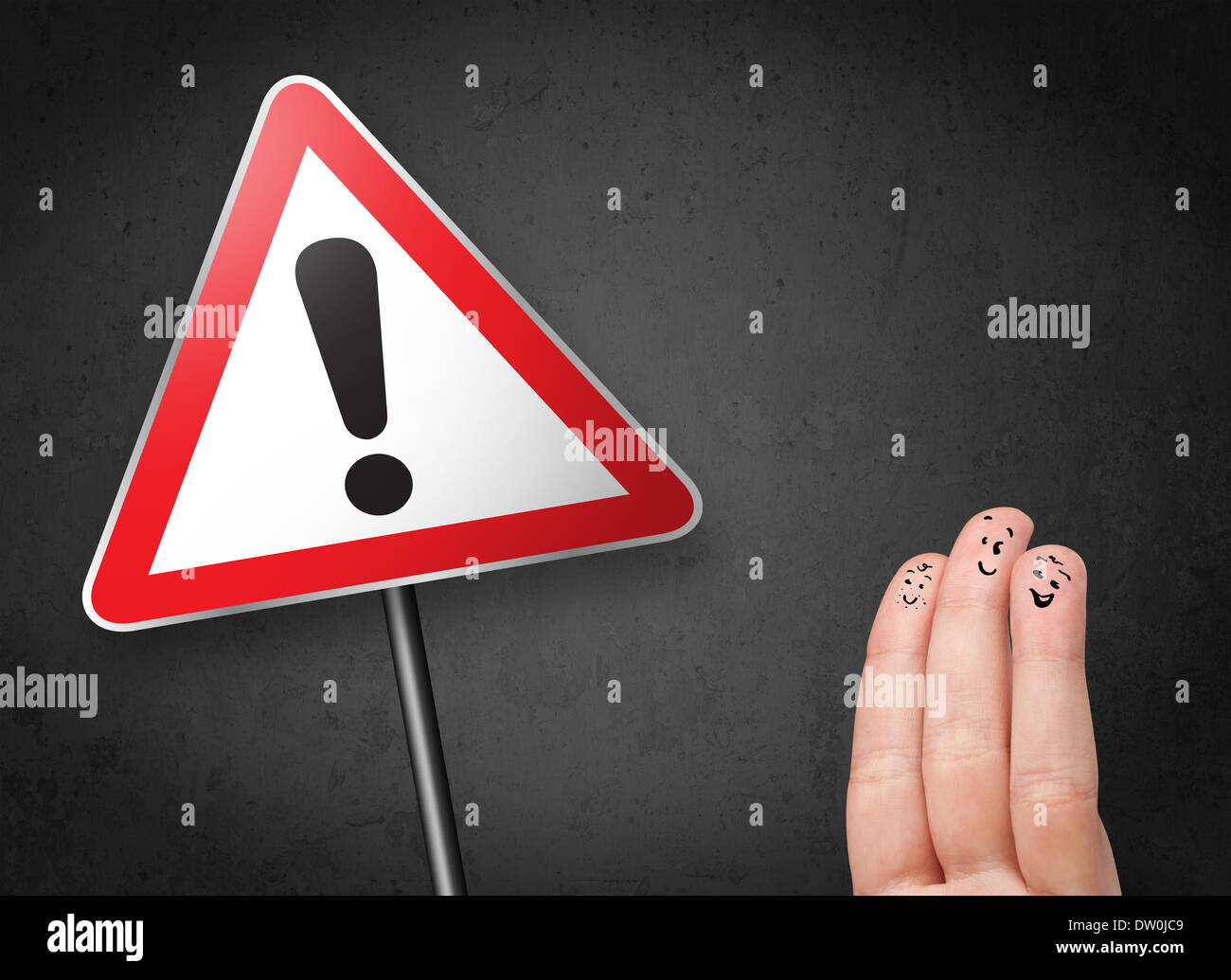 Happy smiley fingers looking at triangle warning sign with exclamation ...