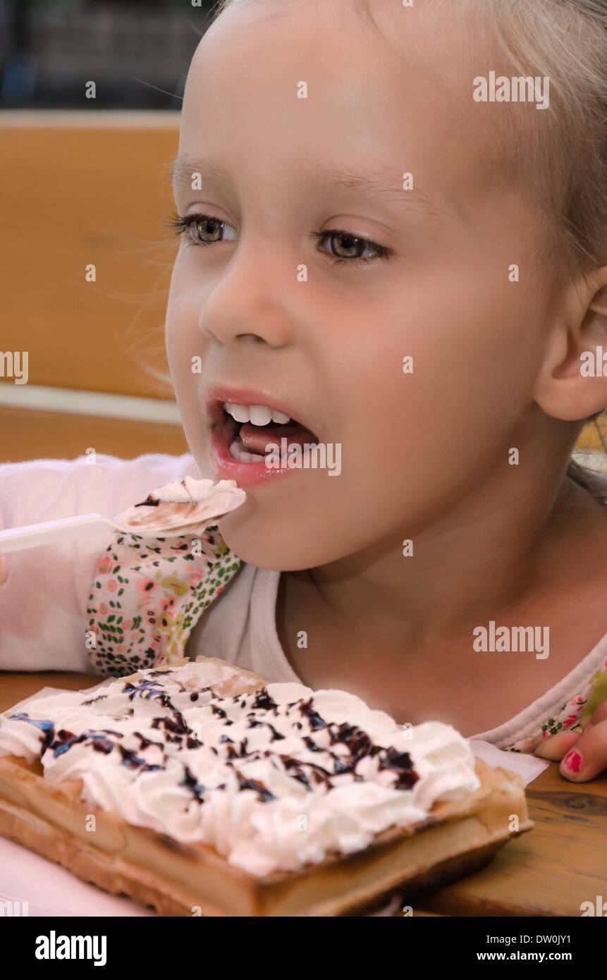 small girls in waffle food Stock Photo - Alamy