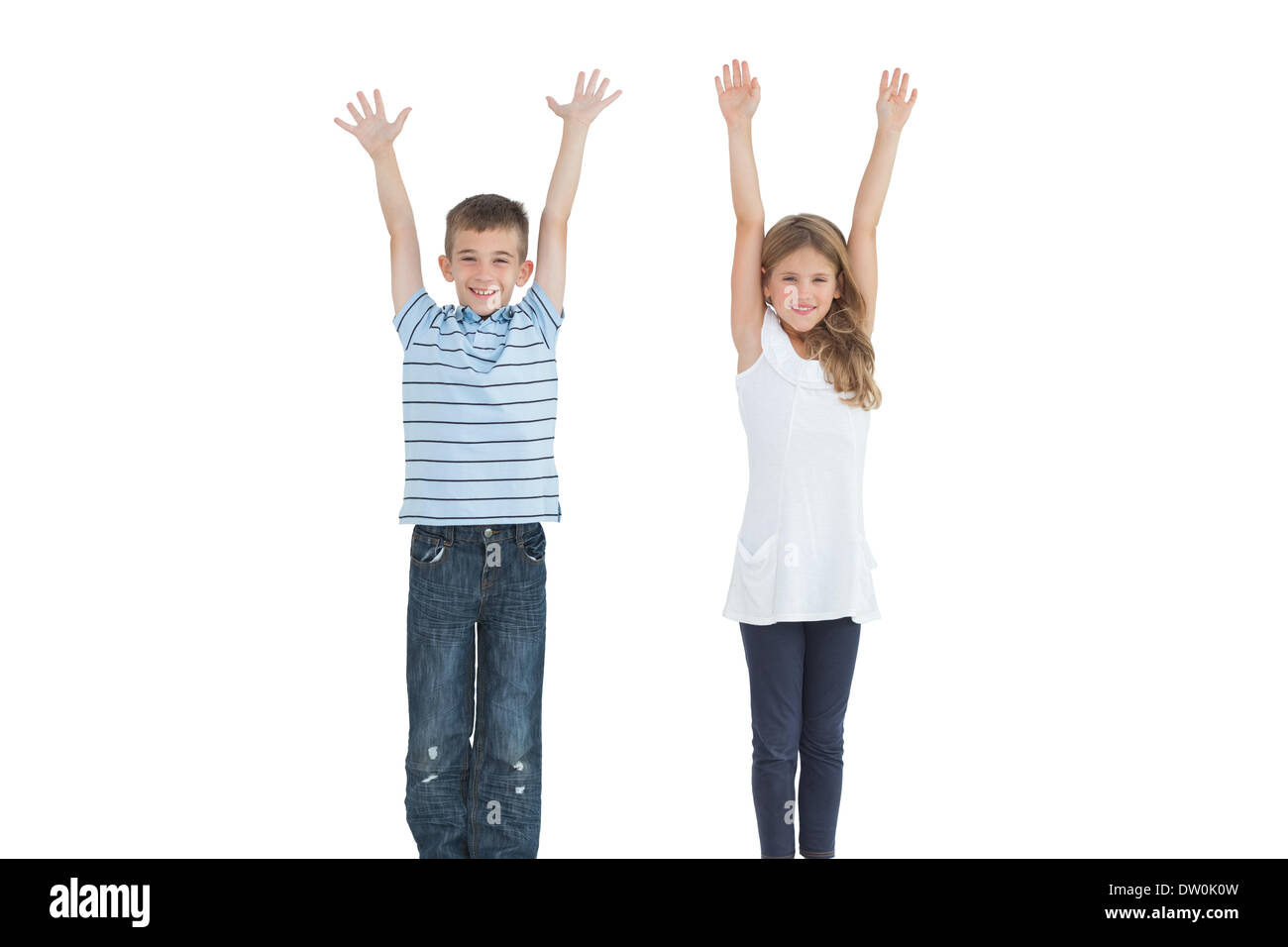 Happy young brother and sister cheering Stock Photo - Alamy