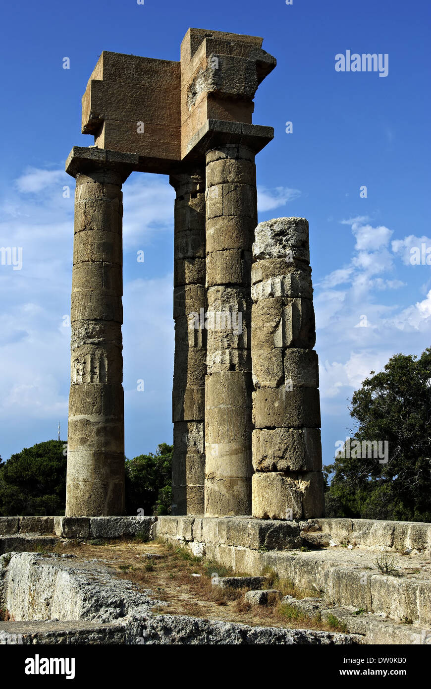 Remains of ancient Greek temple, few stone columns, at sunny summer day ...