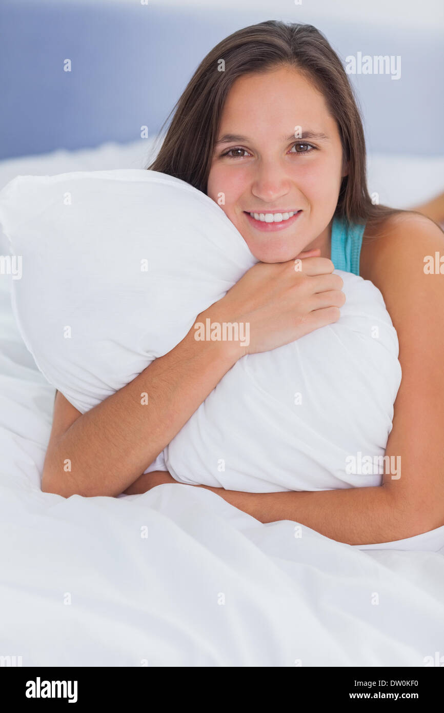 Woman lying in bed Stock Photo - Alamy