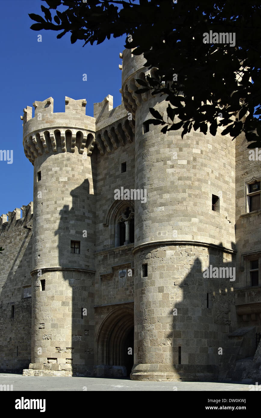 Medieval castle entrance with two towers in front at summer sunny day ...