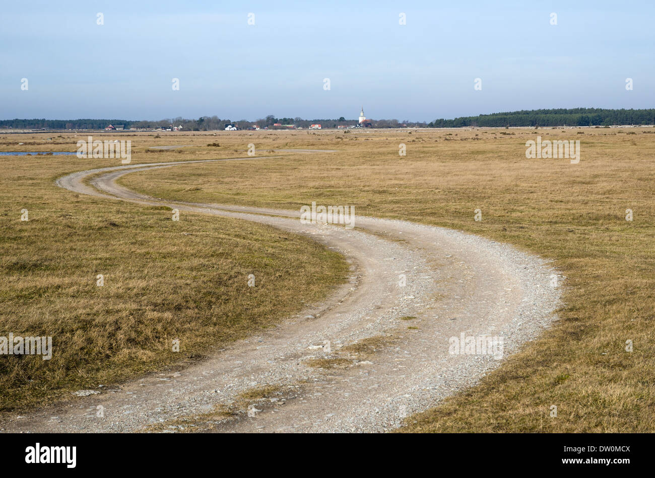 Winding dirt road with a small swedish village ahead Stock Photo - Alamy