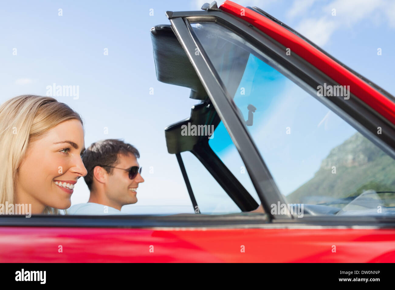 Cheerful couple going on holidays together Stock Photo - Alamy