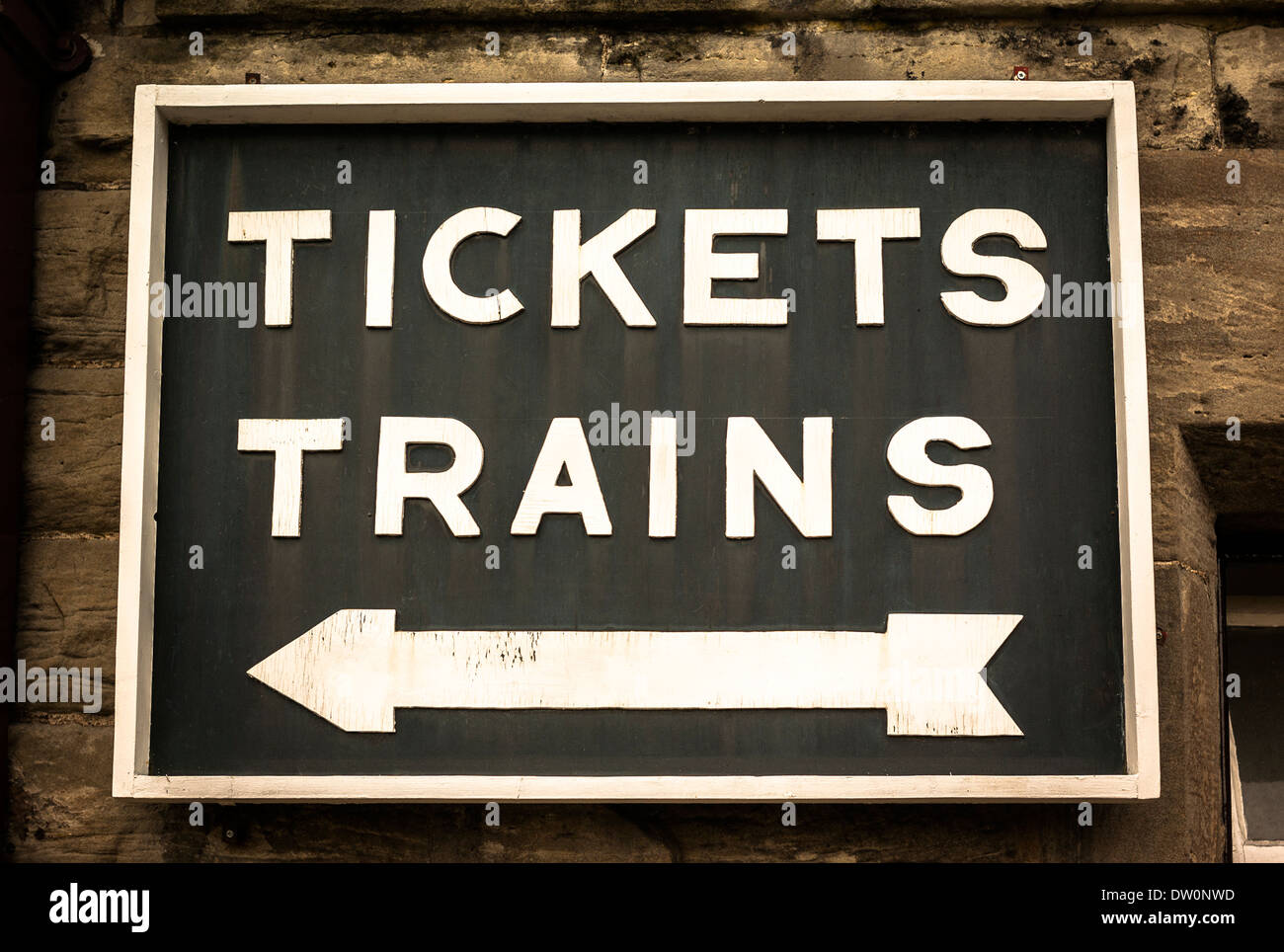 Sign in railway station pointing the way to the Booking Office and ...