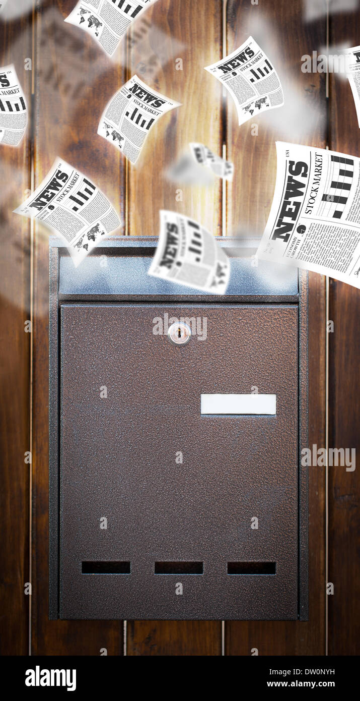 Post box with daily newspapers flying Stock Photo - Alamy