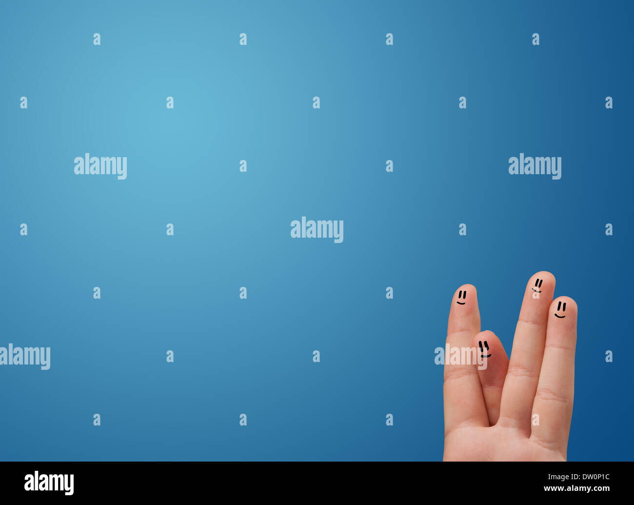 Happy smiley face fingers looking at empty blue background copy space ...