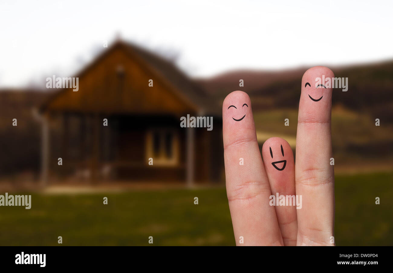 Finger hug and new house in background Stock Photo - Alamy