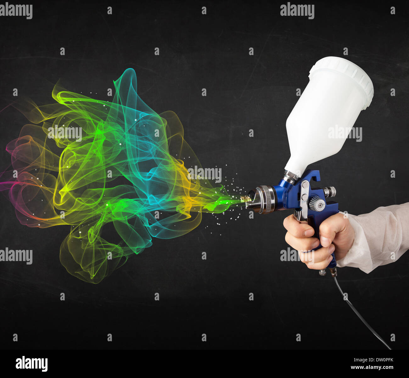 Painter working with airbrush and paints colorful paint Stock Photo - Alamy