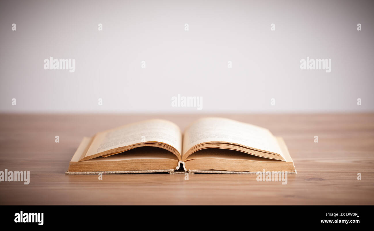 Open Book on wood background Stock Photo - Alamy