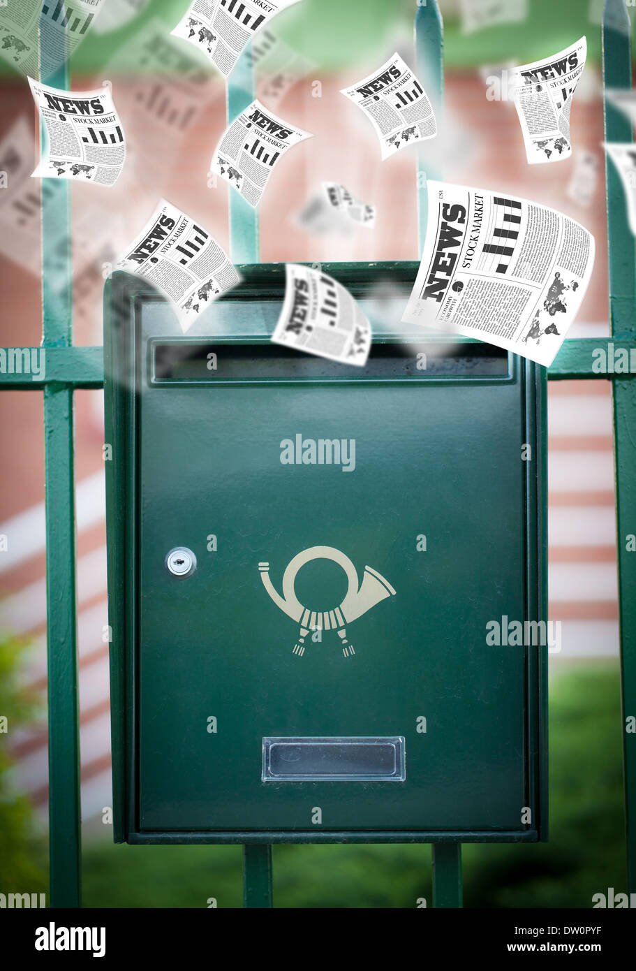 Post box with daily newspapers flying Stock Photo - Alamy