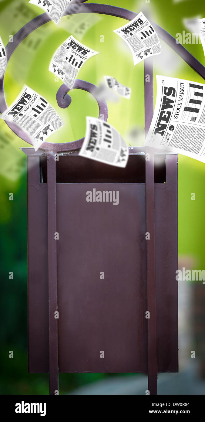 Post box with daily newspapers flying Stock Photo - Alamy