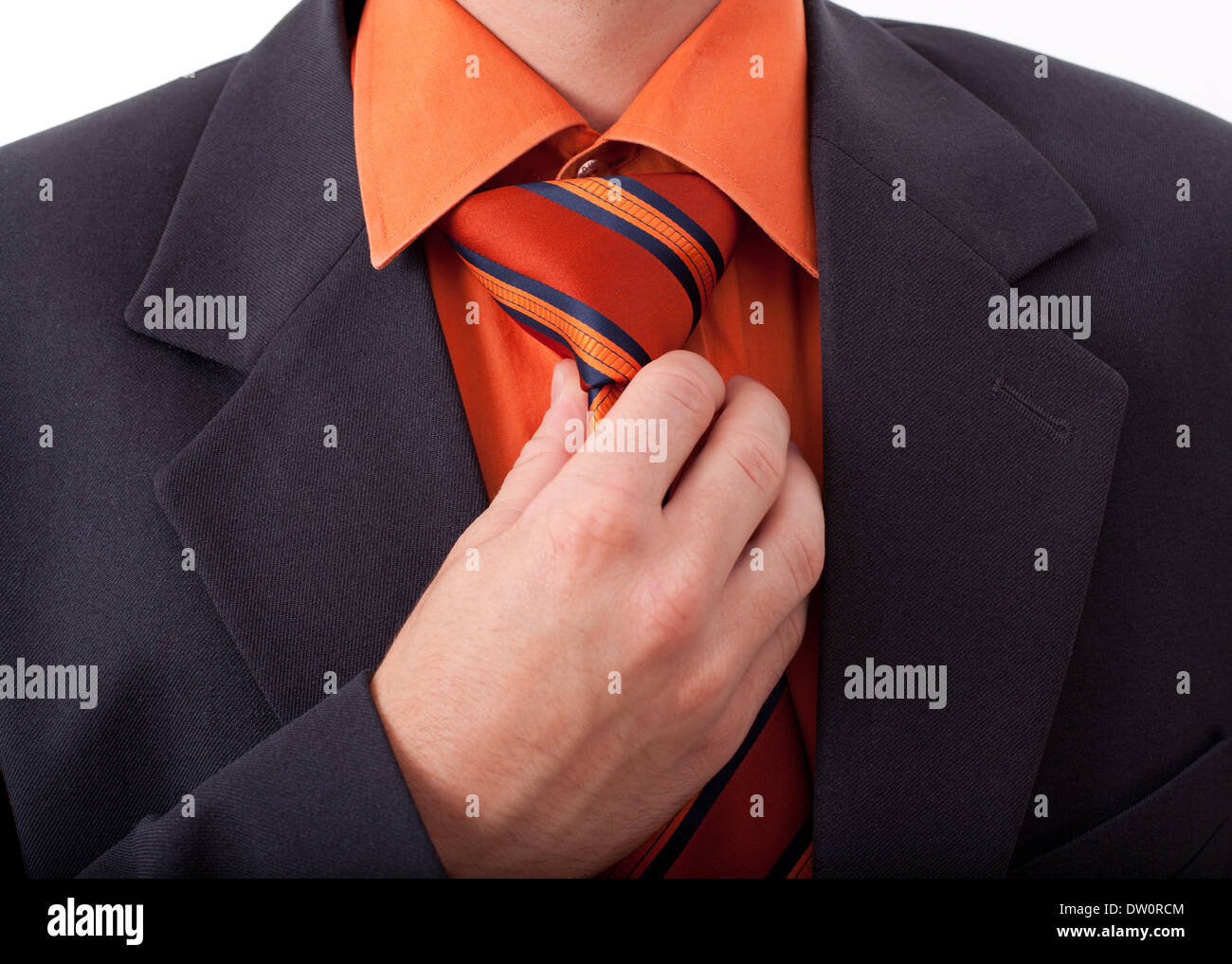 Detail of a man, fixing his tie Stock Photo - Alamy