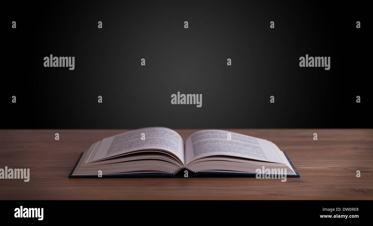 Open book on wooden deck Stock Photo - Alamy