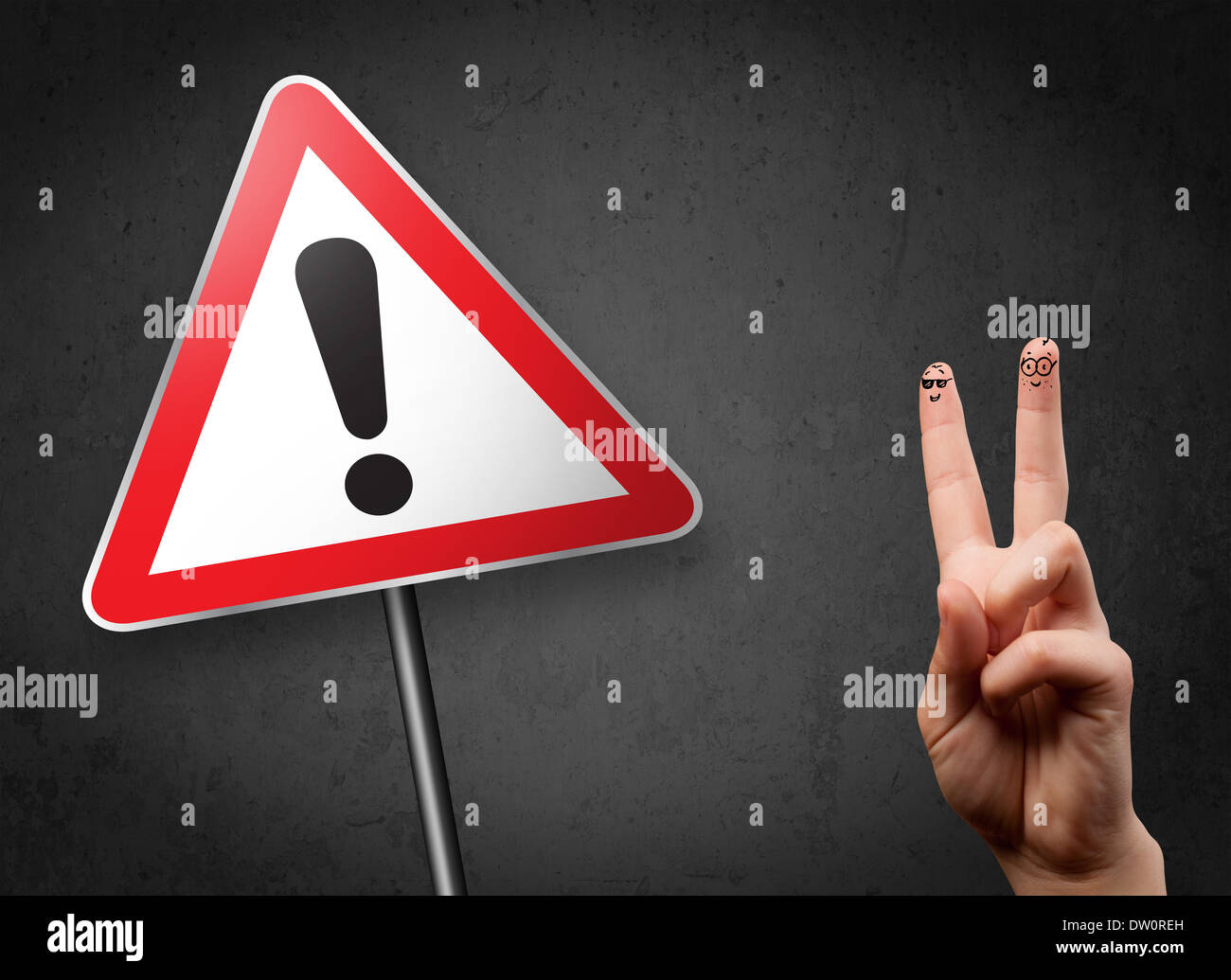 Happy smiley fingers looking at triangle warning sign with exclamation ...