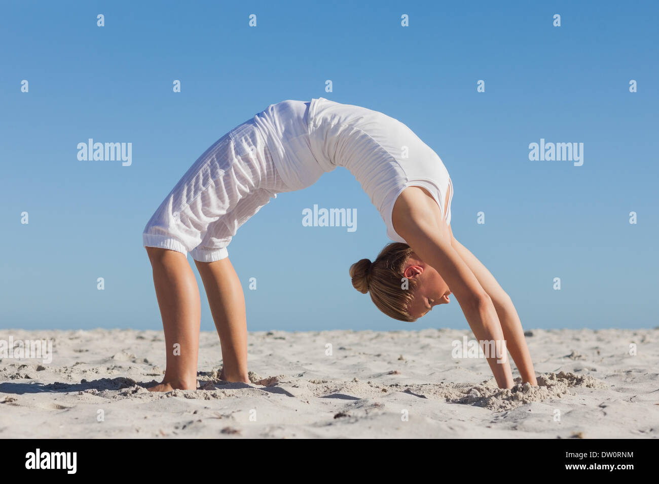 Woman doing crab yoga pose Stock Photo - Alamy