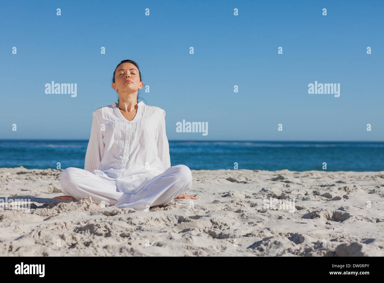 Peaceful woman sitting and relaxing Stock Photo - Alamy