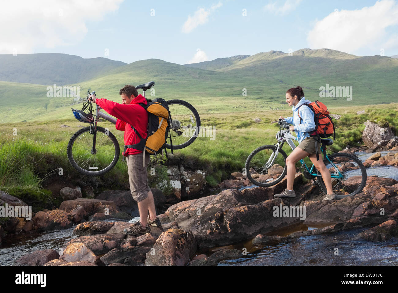 Young couple crossing river hi-res stock photography and images - Alamy