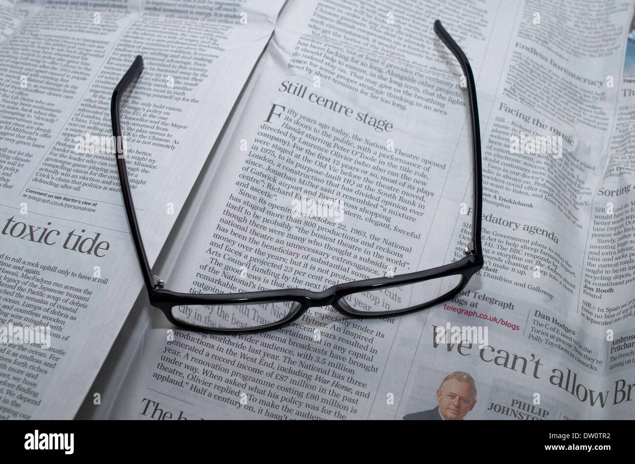 Reading the paper Stock Photo - Alamy