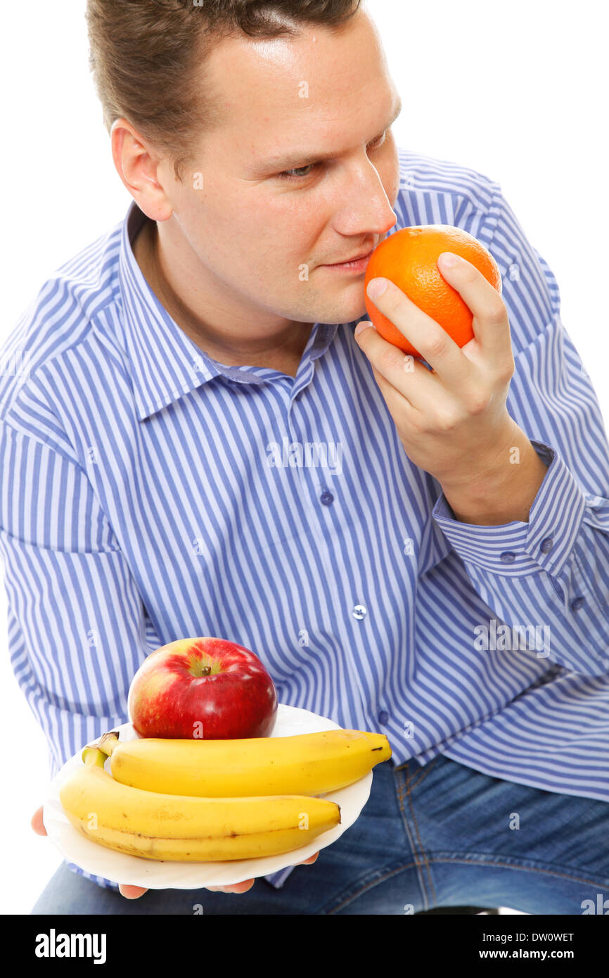 young man with fruits isolated Stock Photo - Alamy