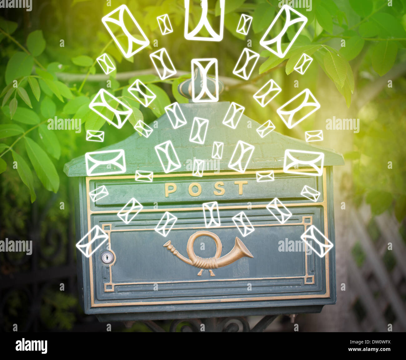 Mailbox with letter icons on glowing green background Stock Photo - Alamy