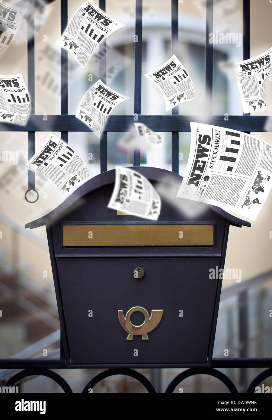 Post box with daily newspapers flying Stock Photo - Alamy