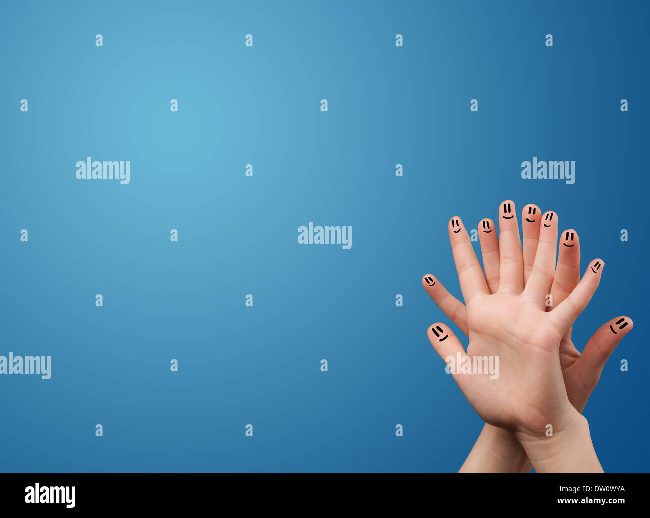 Happy smiley face fingers looking at empty blue background copy space ...
