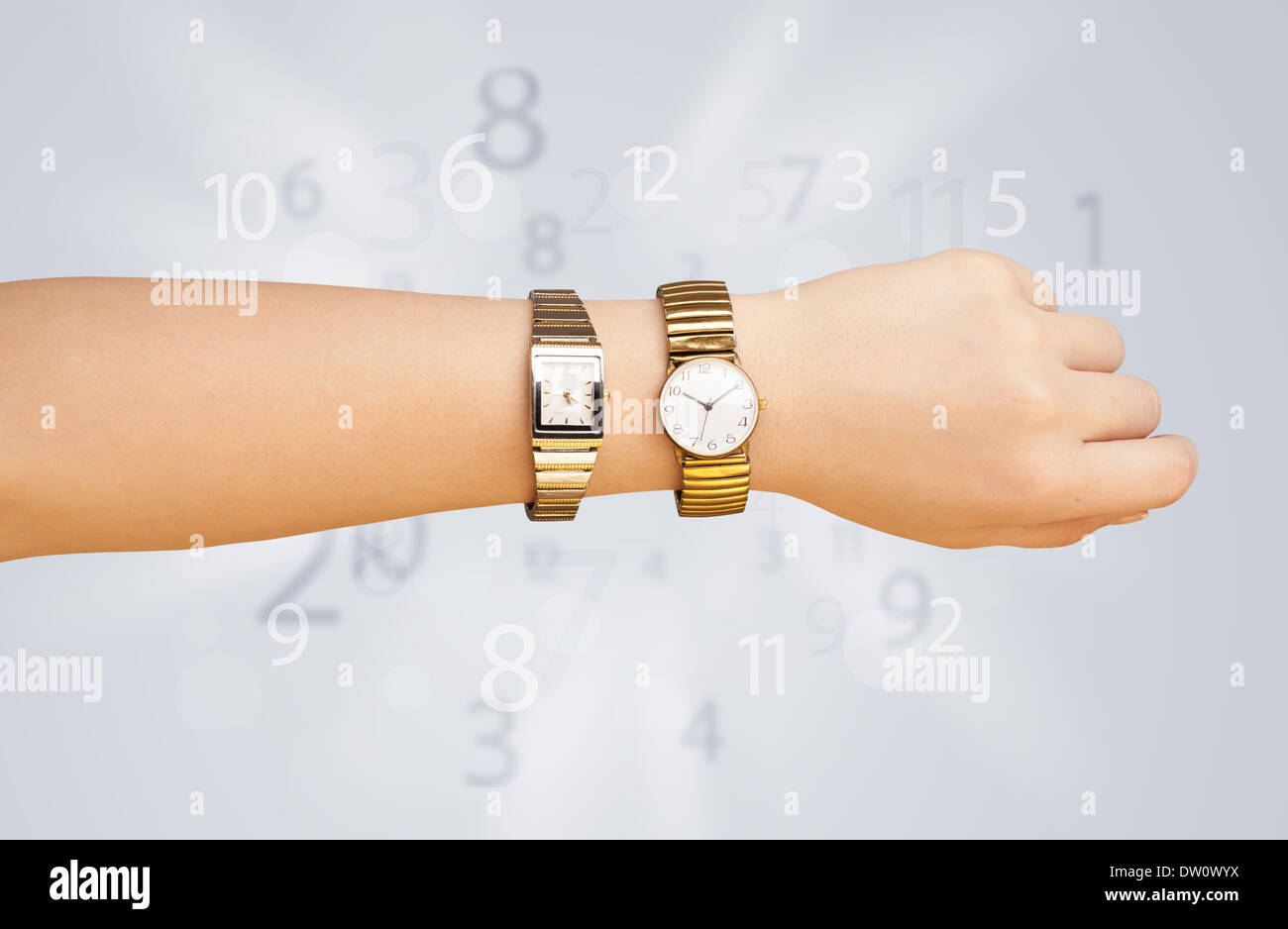 Hand with watch and numbers on the side comming out Stock Photo - Alamy