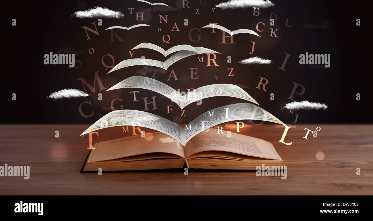 Pages and glowing letters flying out of a book Stock Photo - Alamy
