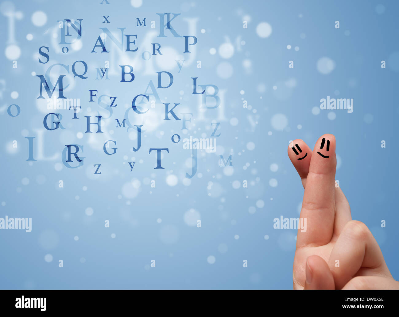 Happy smiley fingers looking at mixture of bokeh letters Stock Photo ...