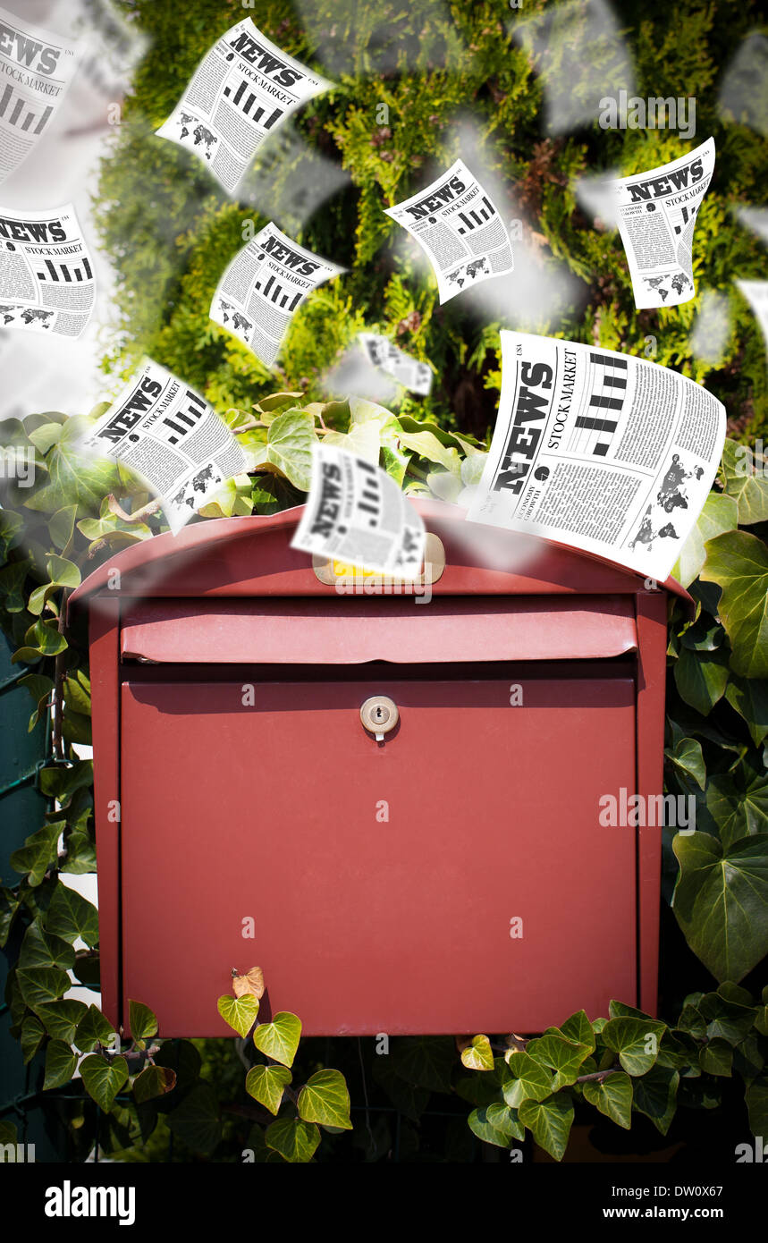 Post box with daily newspapers flying Stock Photo - Alamy