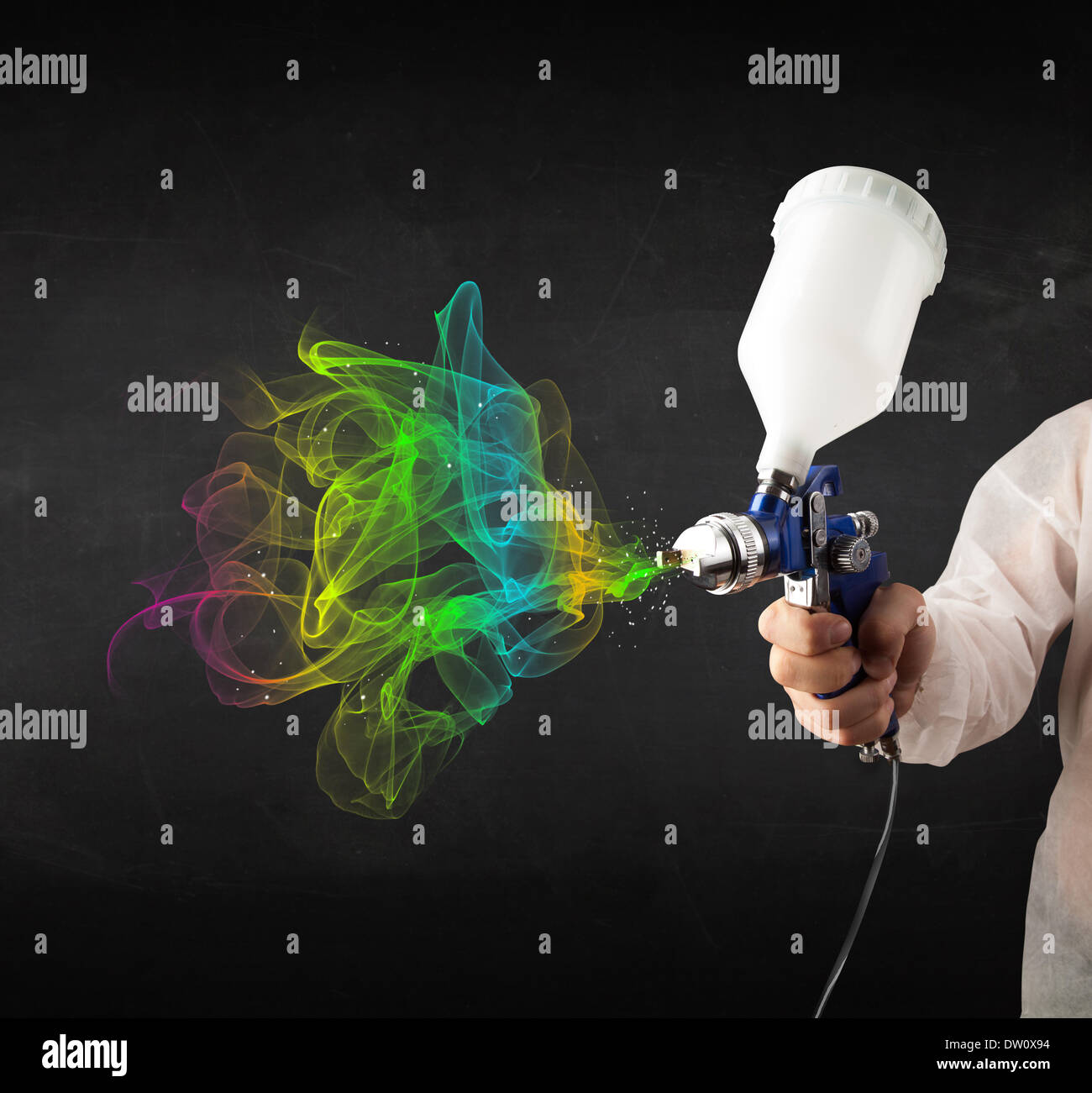 Painter working with airbrush and paints colorful paint Stock Photo - Alamy