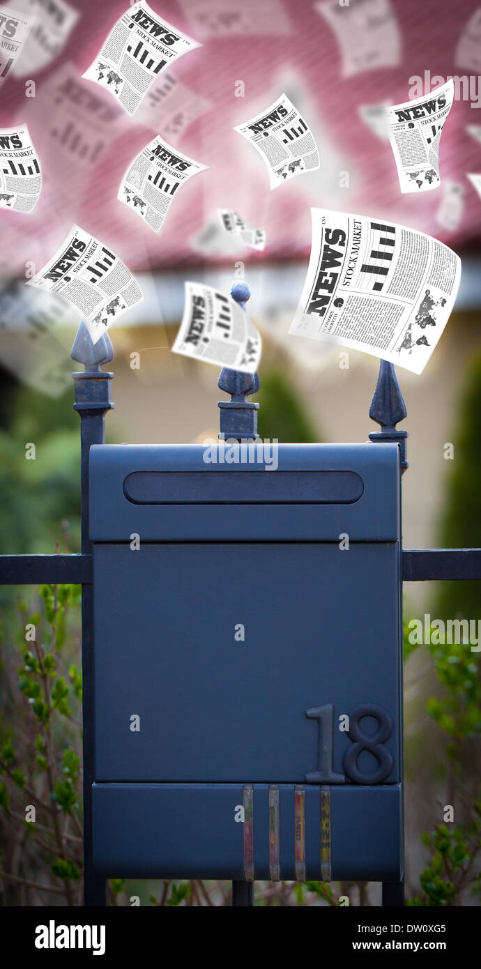 Post box with daily newspapers flying Stock Photo - Alamy